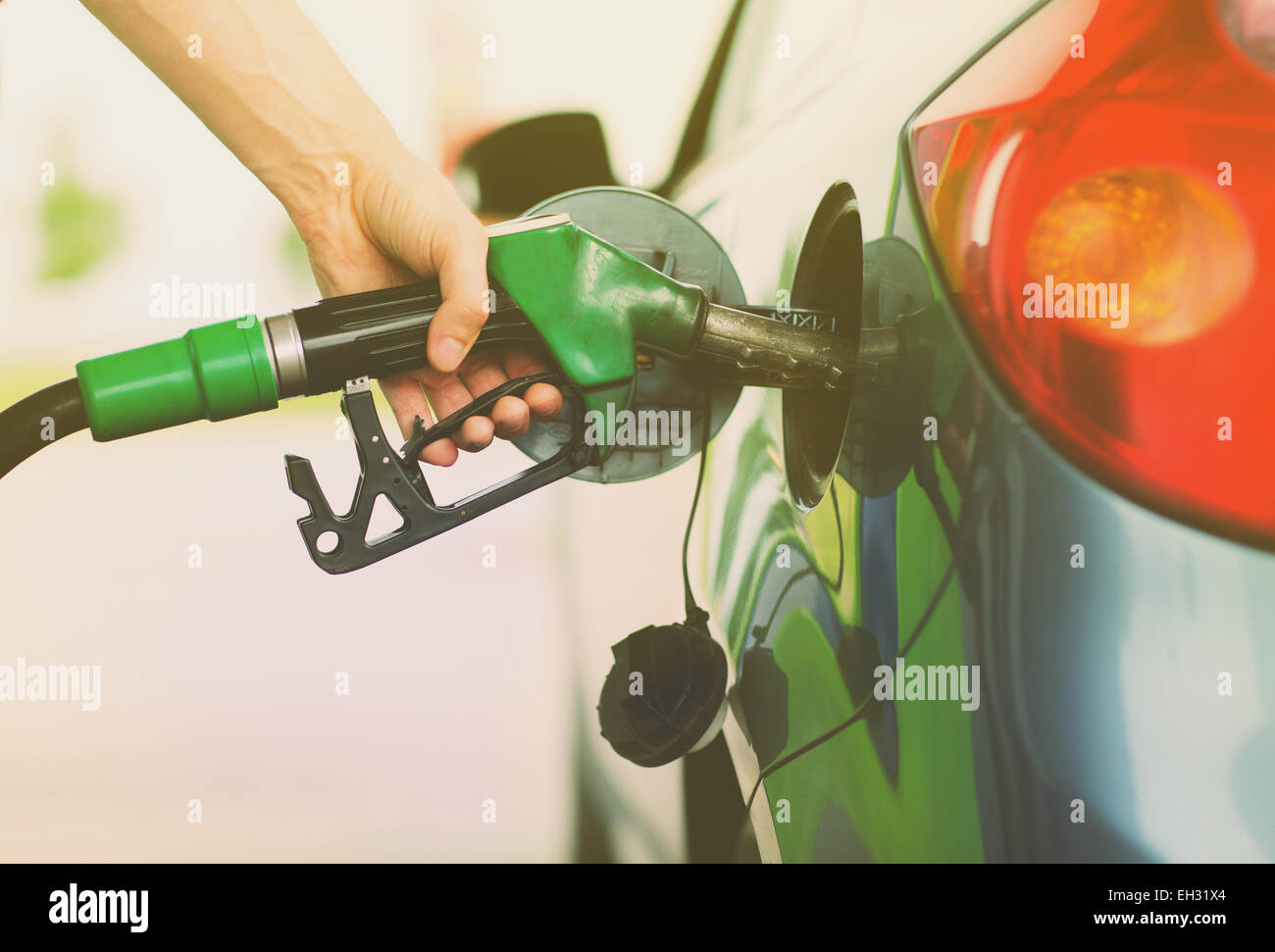 Man pumping gas into her car hi-res stock photography and images - Alamy