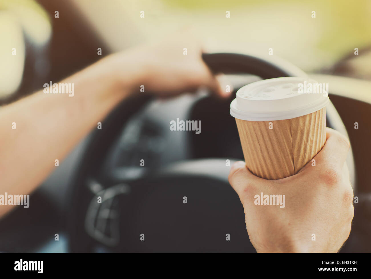 man drinking coffee while driving the car Stock Photo - Alamy