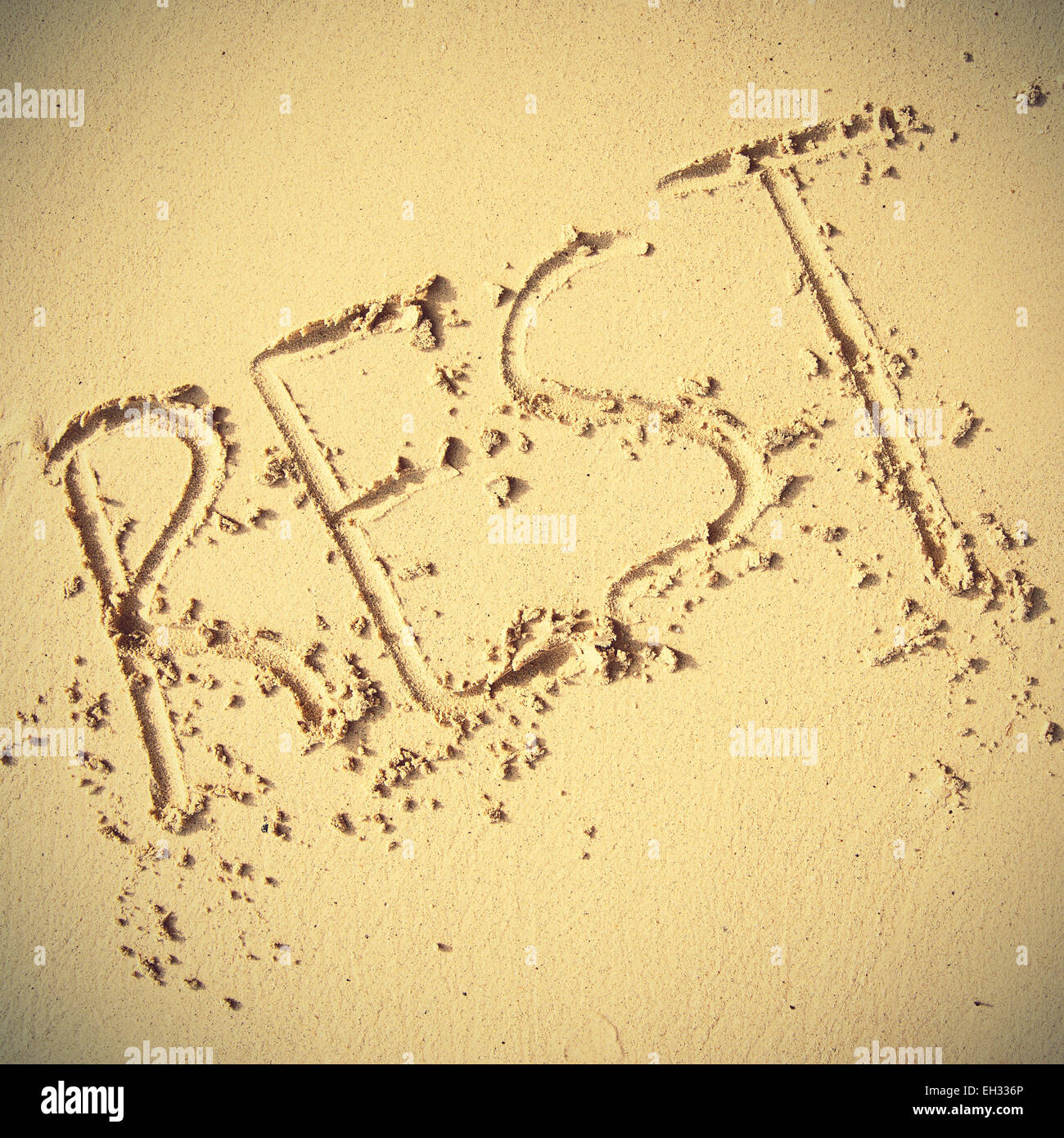 Word "Rest" written on the sand. Retro style filtred image Stock Photo ...
