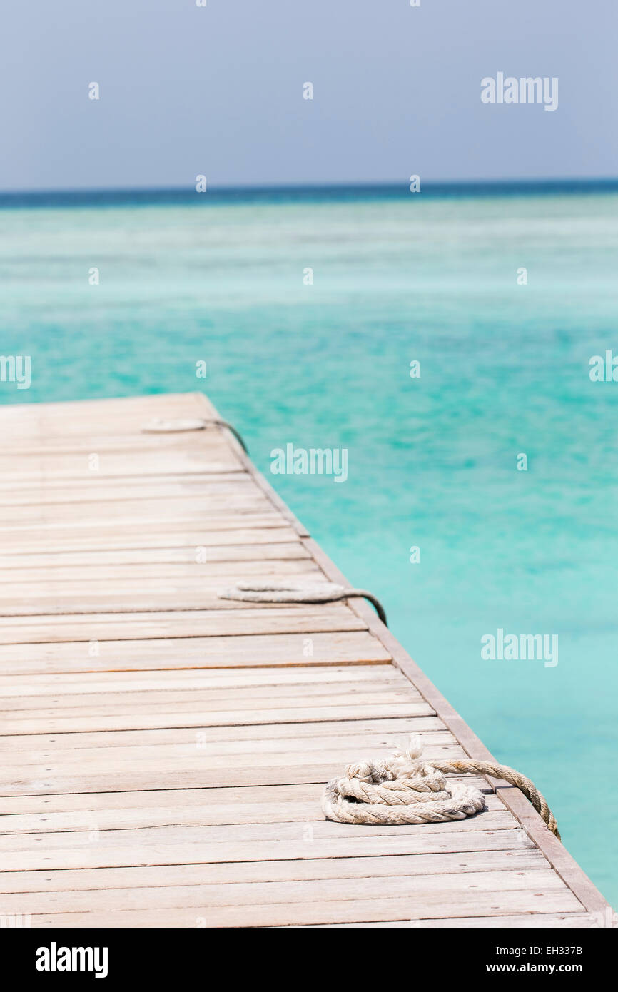 Ropes coiled on the wooden boat jetty at Makunudu Island Resort, North ...