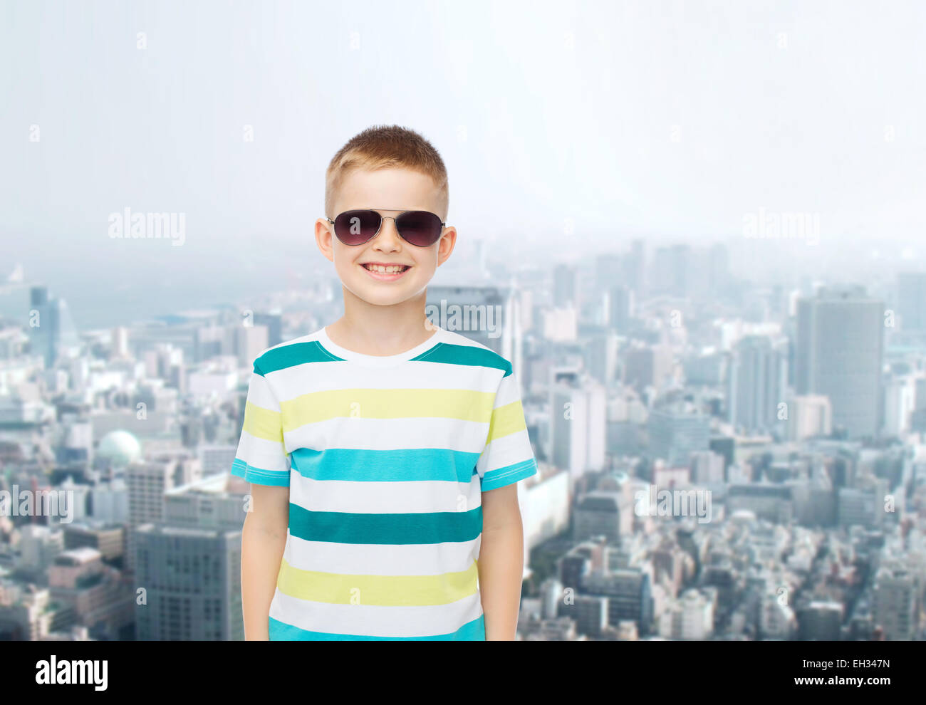 smiling little boy over green background Stock Photo - Alamy
