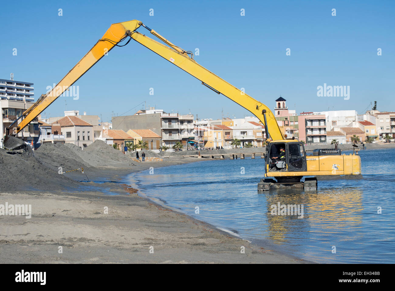 Sand excavation work on the beach at Los Alcazares in Murcia, Spain ...