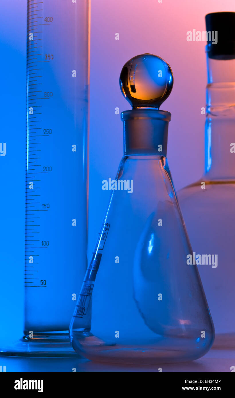 chemical glassware in multicolored lights Stock Photo - Alamy