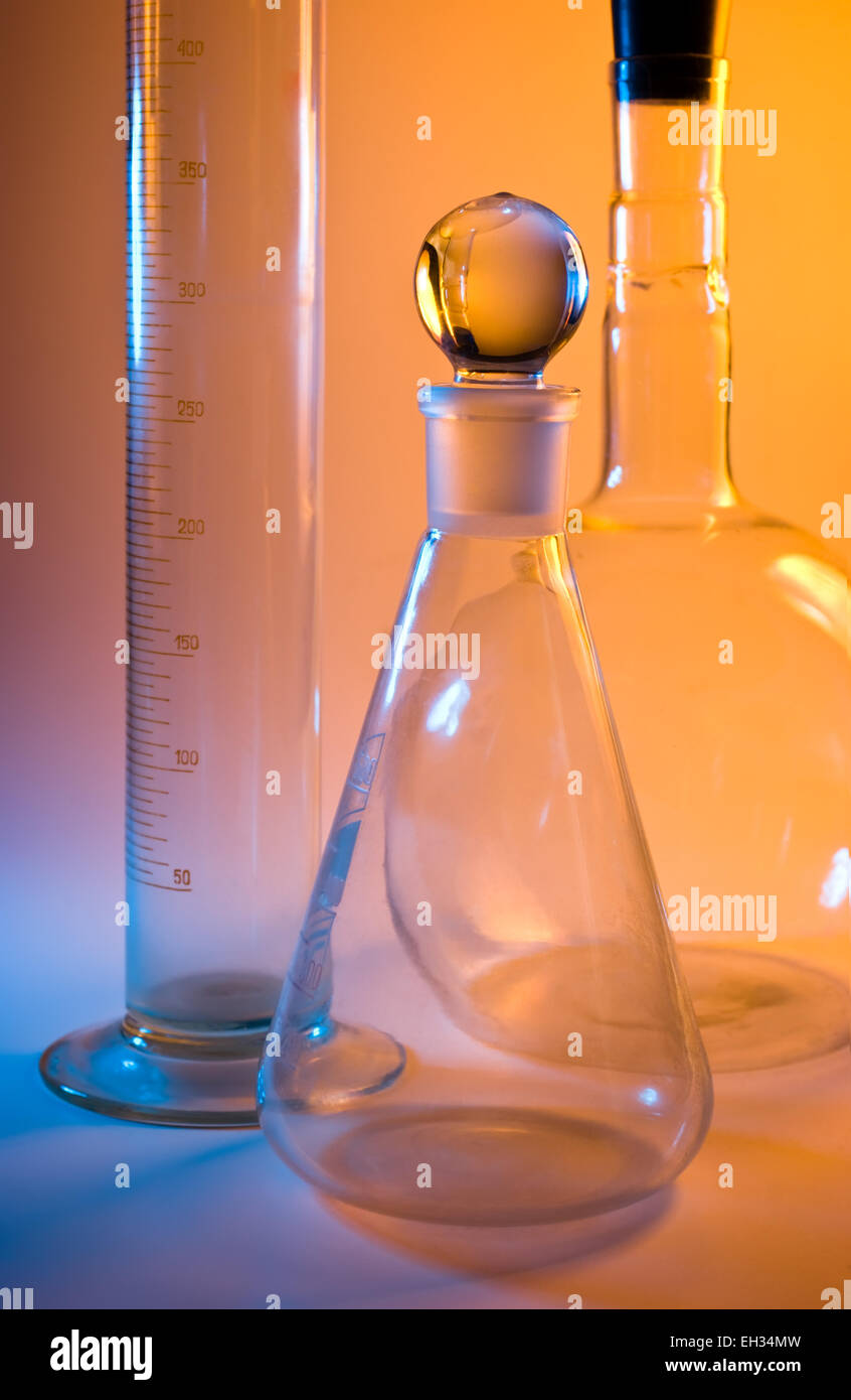 chemical glassware in multicolored lights Stock Photo - Alamy