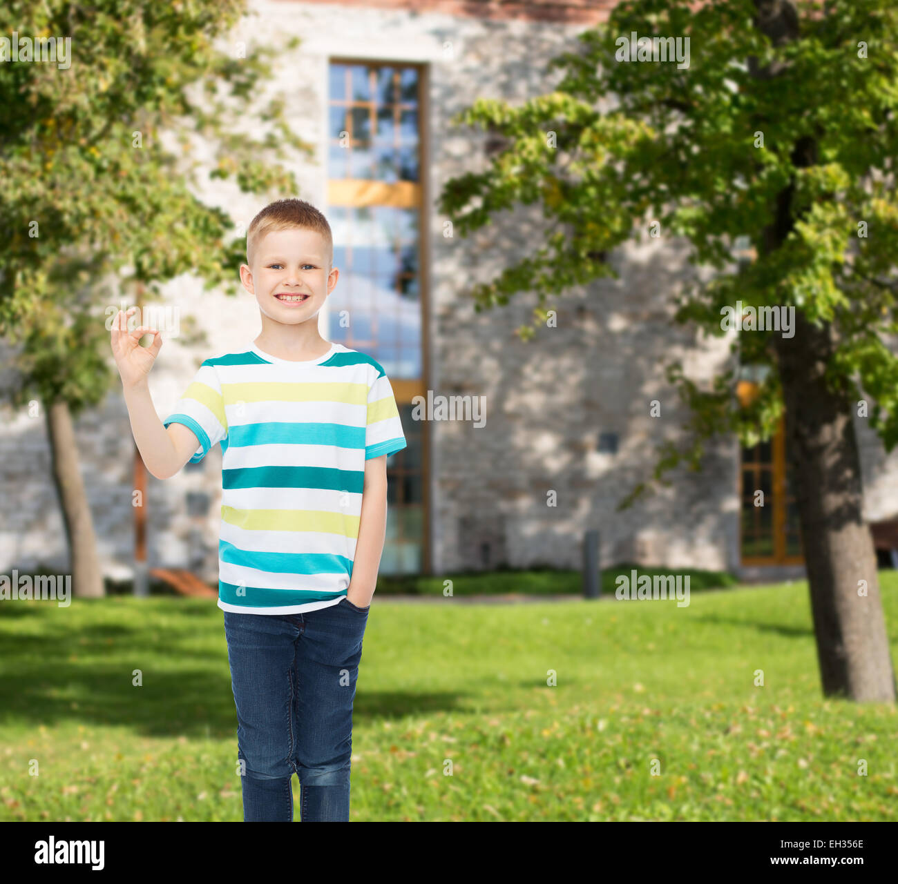 smiling little boy showing ok sign Stock Photo - Alamy