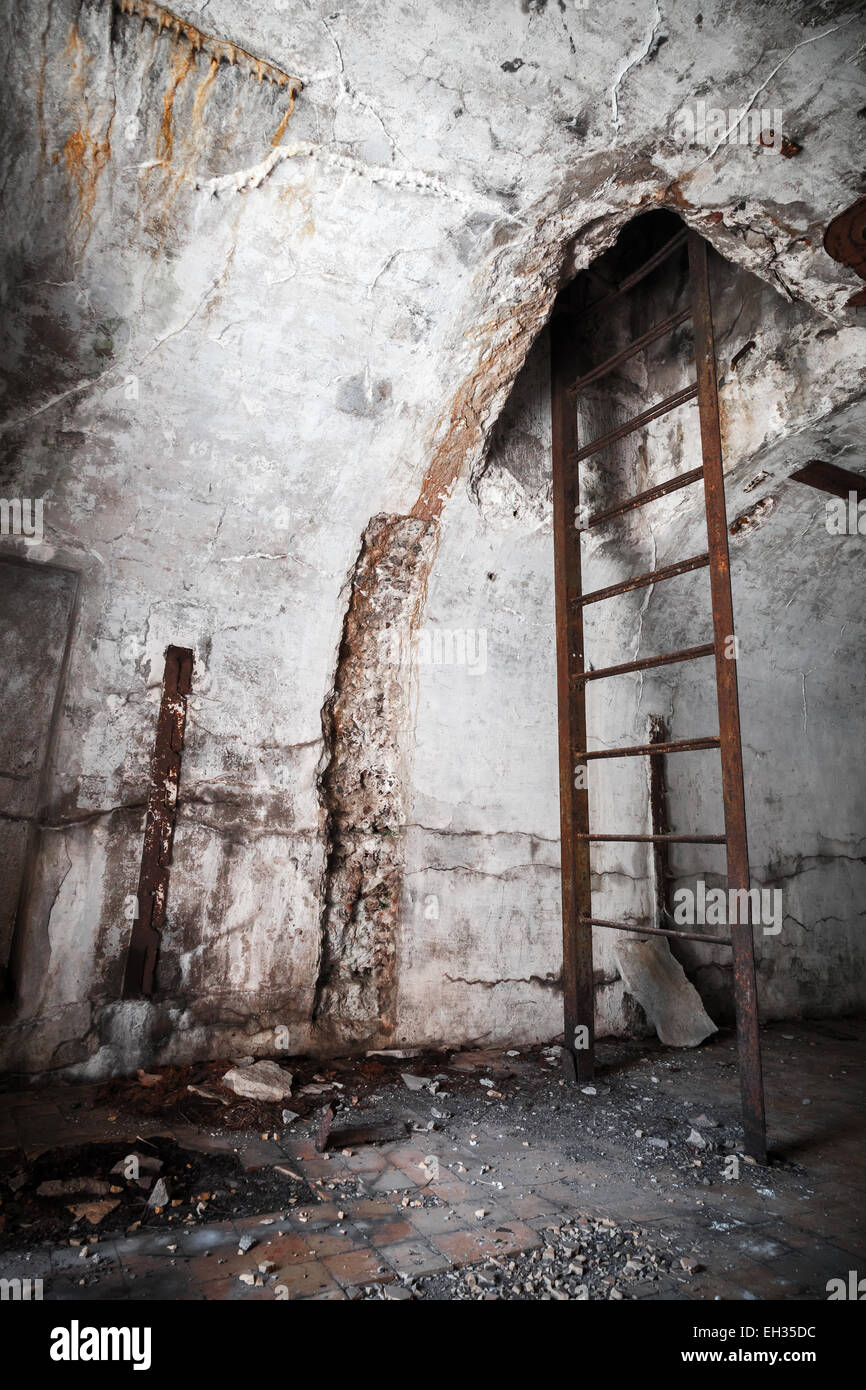 Old abandoned empty bunker interior with white walls and rusted ...