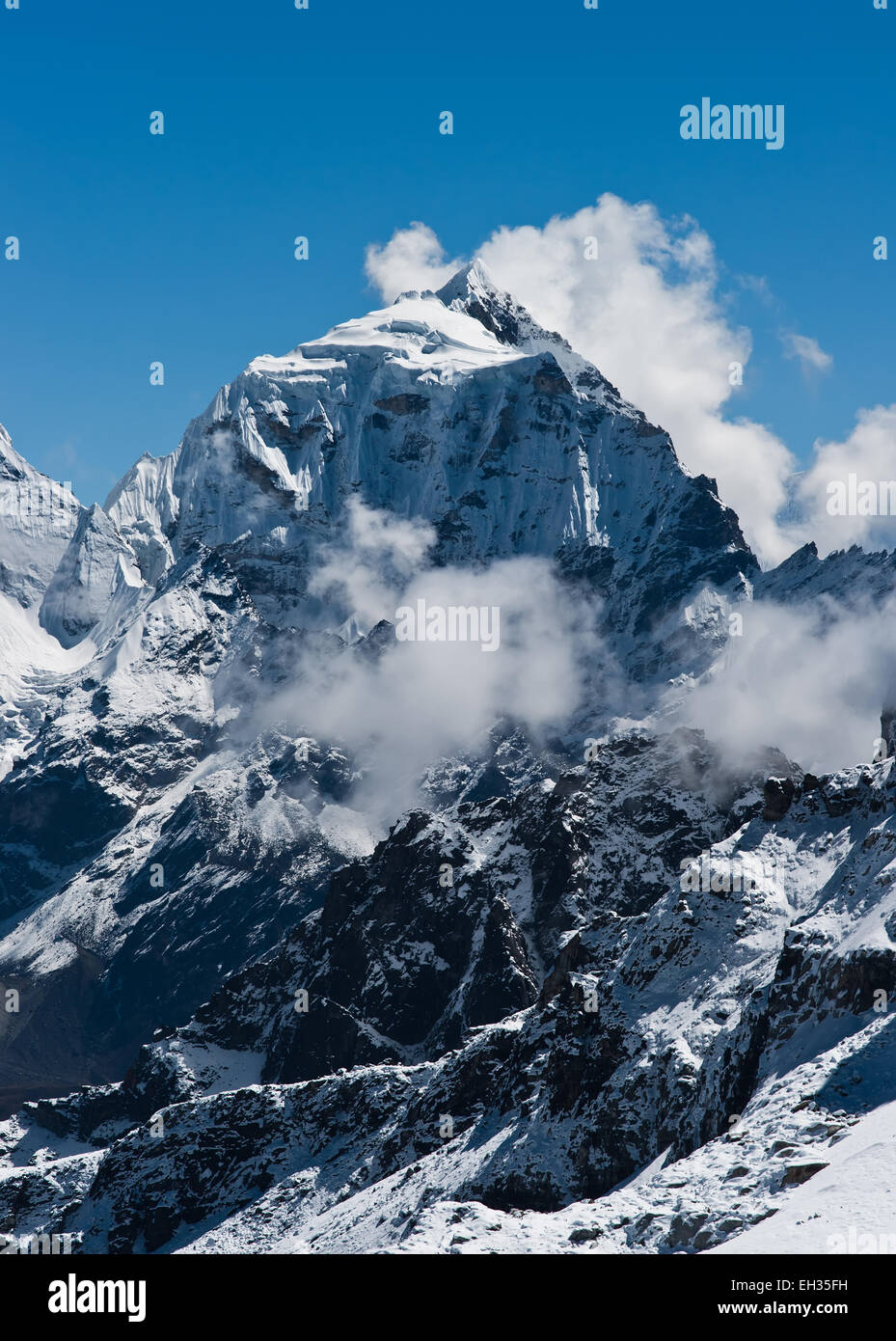 Taboche mountain peak and clouds viewed from Renjo pass. In Himalayas ...