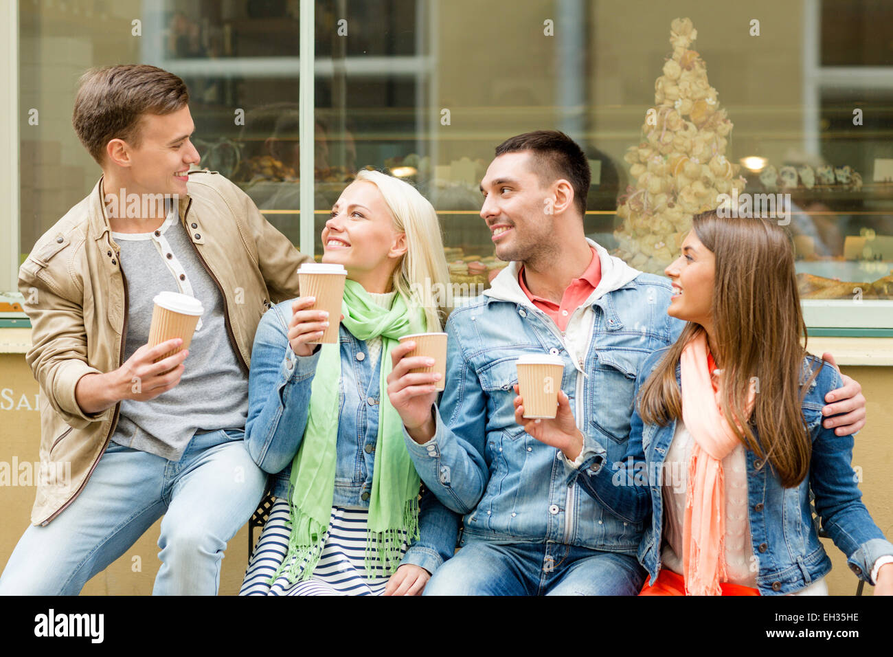Four young men drinking coffee hi-res stock photography and images - Alamy