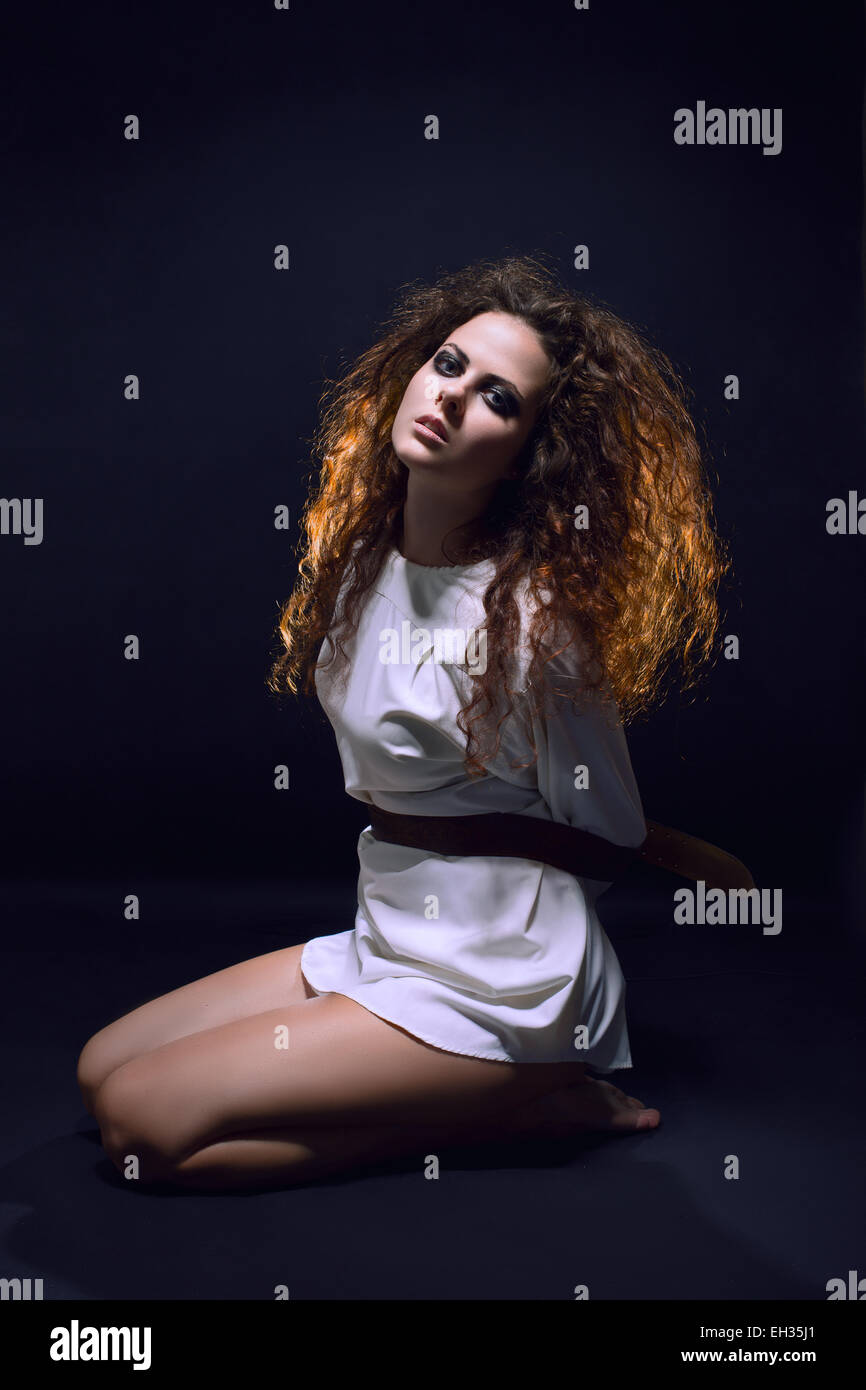 sad young woman prisoner looking in camera Stock Photo - Alamy