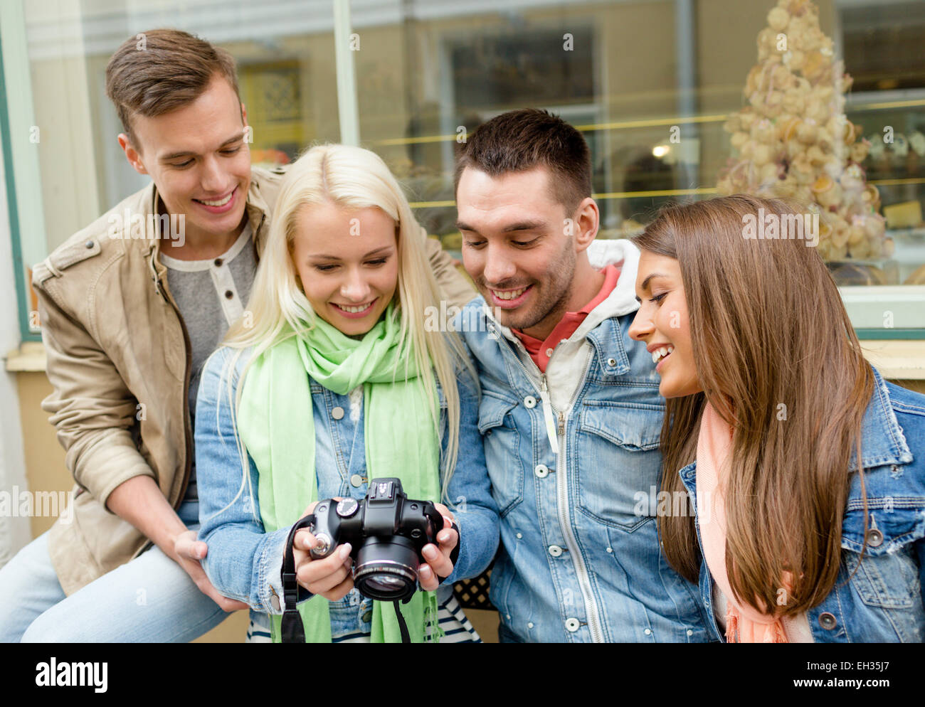 group of smiling friends with digital photocamera Stock Photo - Alamy