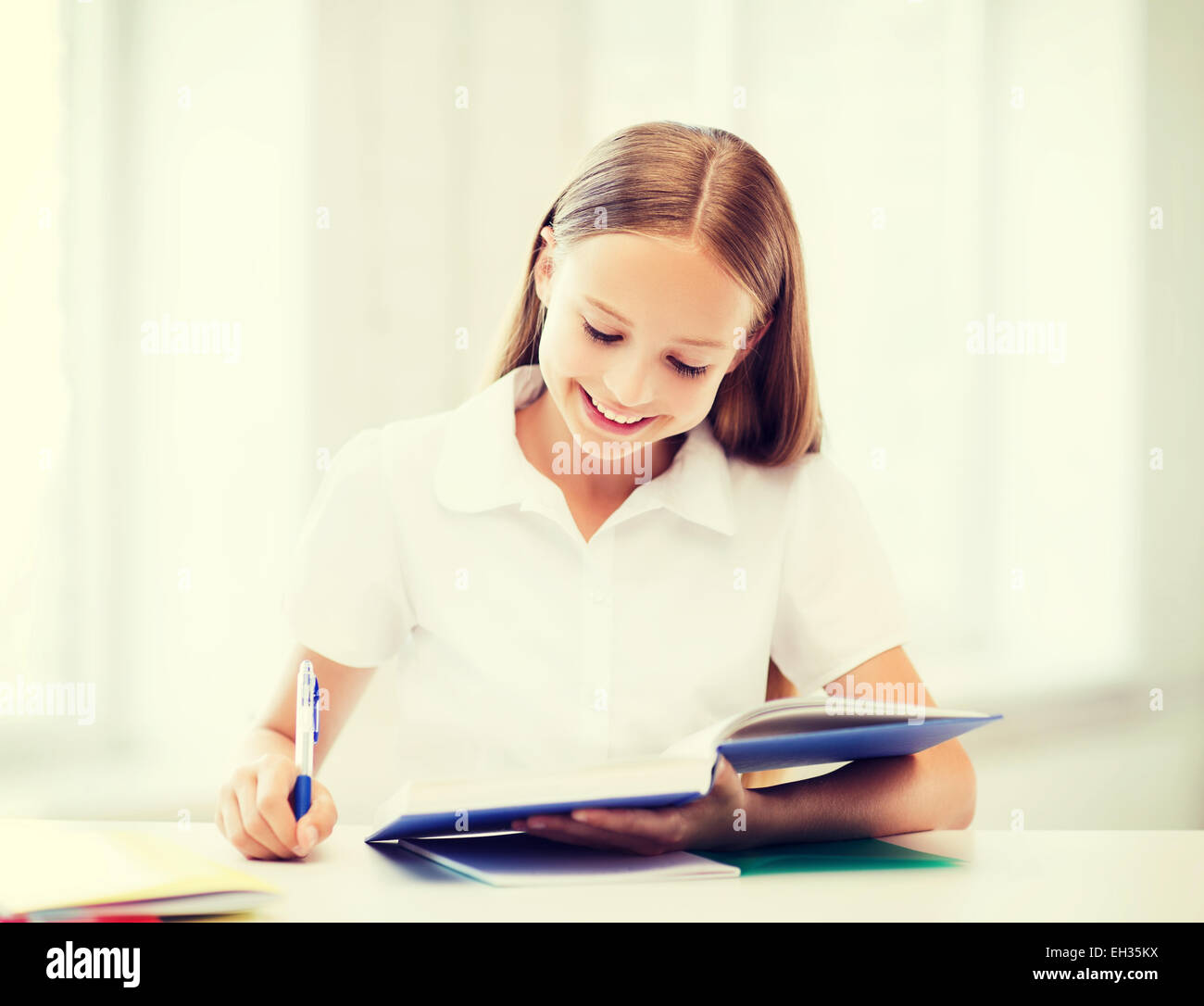 student girl studying at school Stock Photo - Alamy