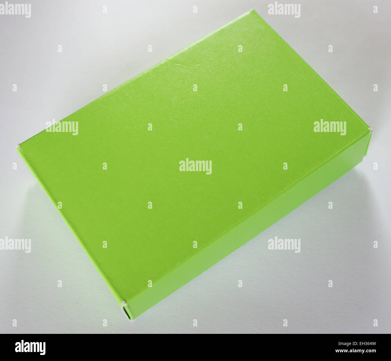 Green yellow paper box packet Stock Photo - Alamy