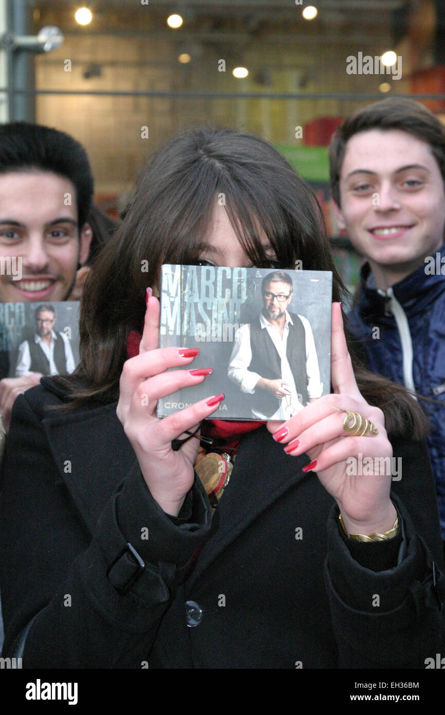 A fan with an album of Marco Marsini, the singer meet his fans after ...