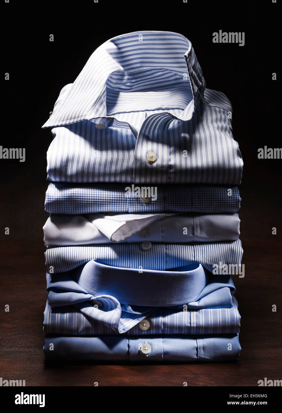 Folded stack of men's shirts hi-res stock photography and images - Alamy