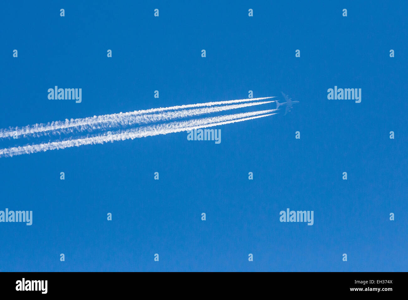 Jet leaving contrails high above Lassen National Park, California, USA ...
