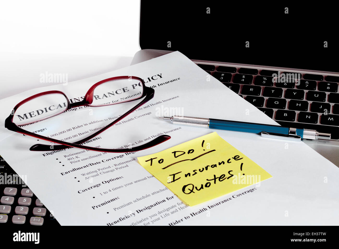 Sample Insurance Policy business document with laptop and calculator ...