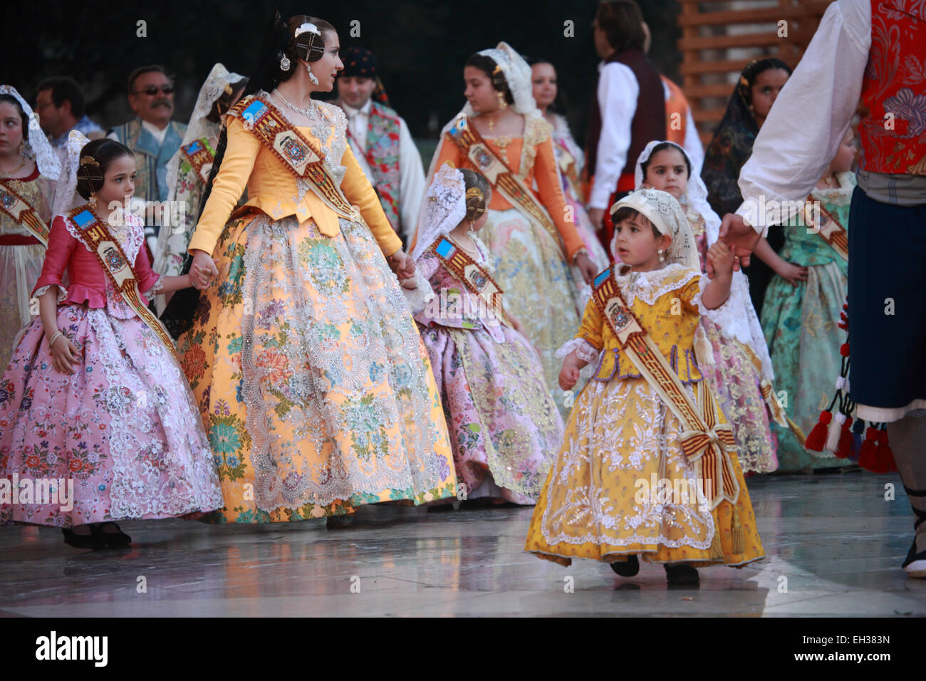 women and children dressed in traditional las fallas festival costumes ...