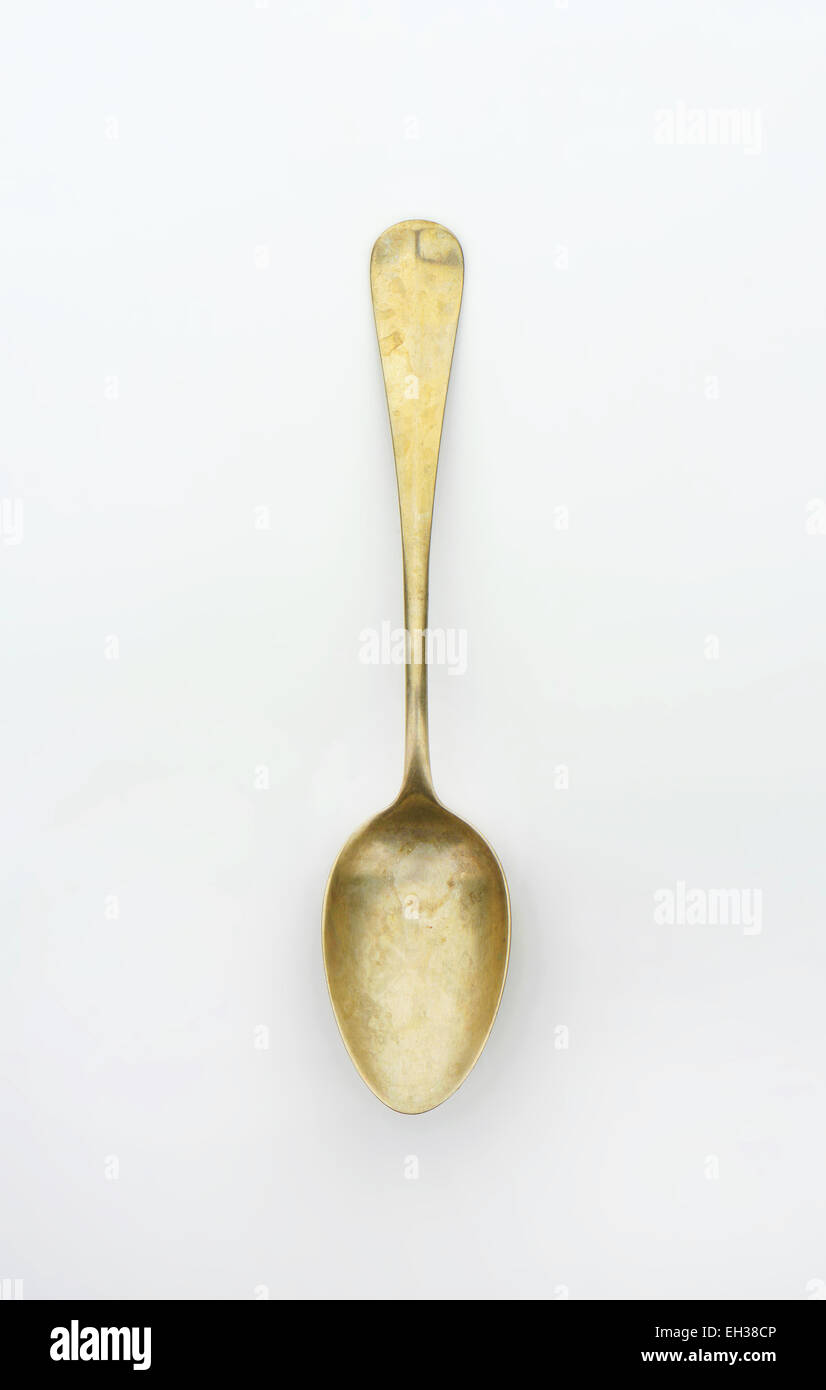 Old silver tea spoon on white background Stock Photo - Alamy