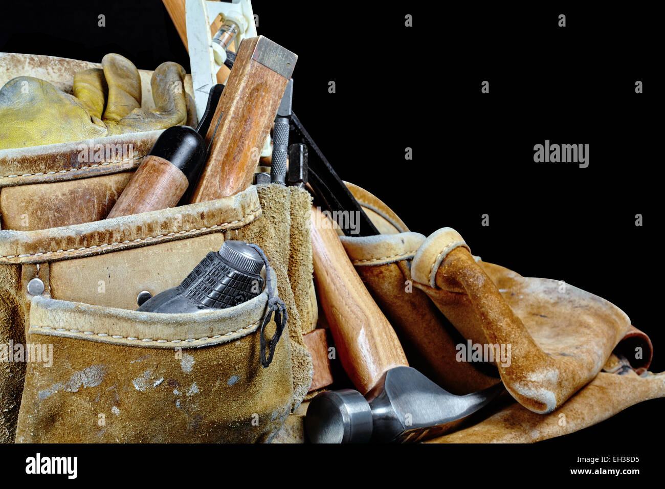 Rugged worn carpenters leather work bags and belt with construction ...