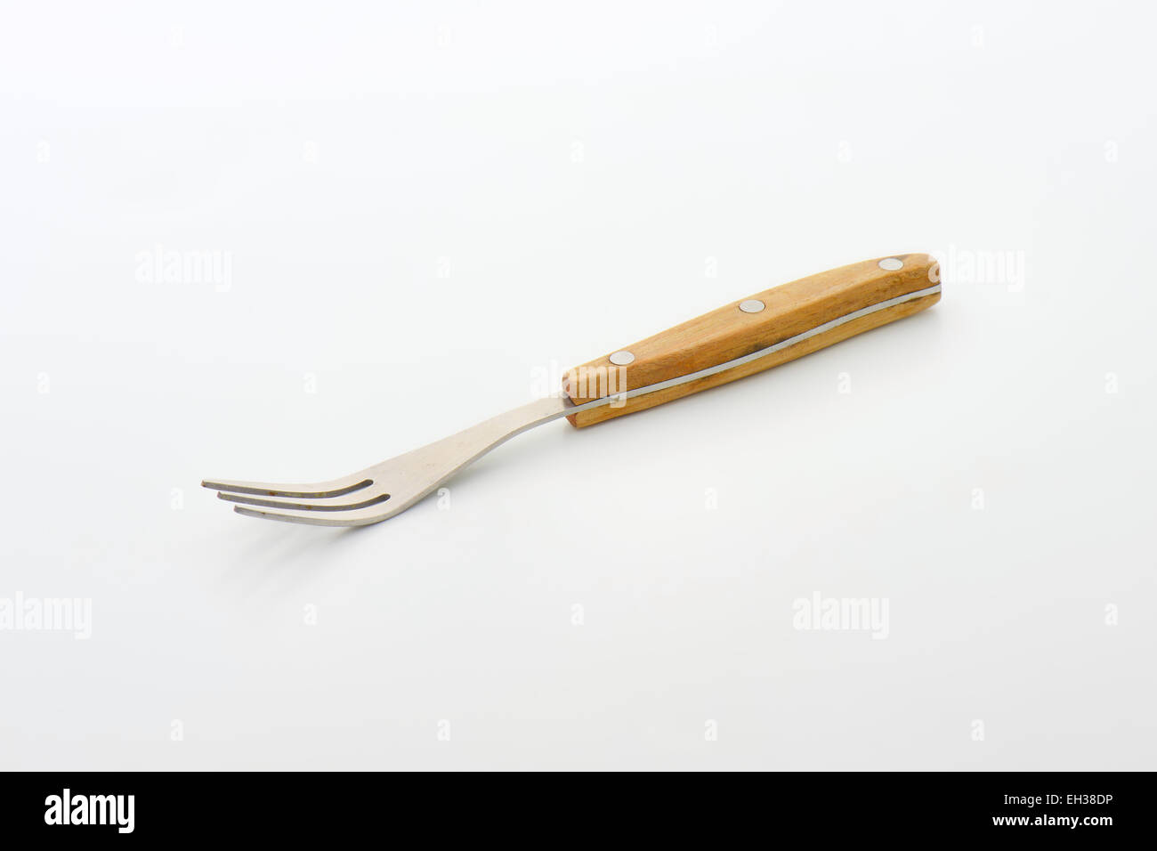 Steak fork with wooden handle Stock Photo - Alamy