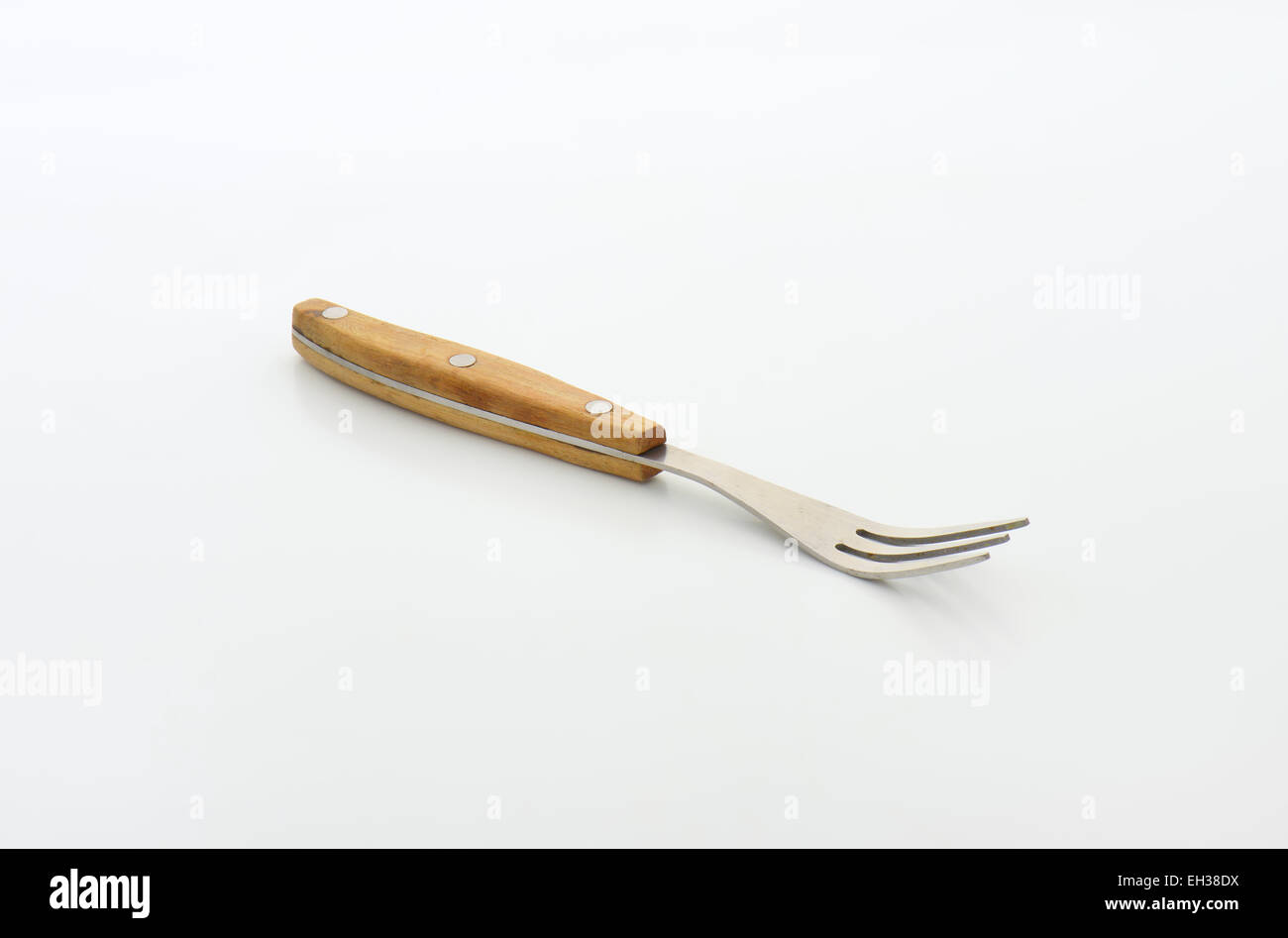 Steak fork with wooden handle Stock Photo - Alamy