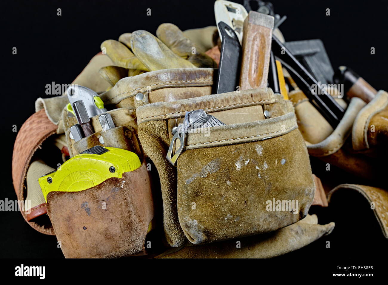 Rugged worn carpenters leather work bags and belt with vintage ...