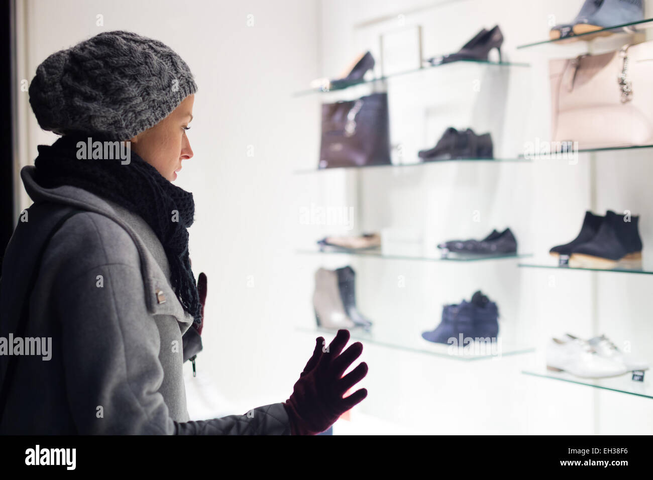Woman window shopping Stock Photo - Alamy
