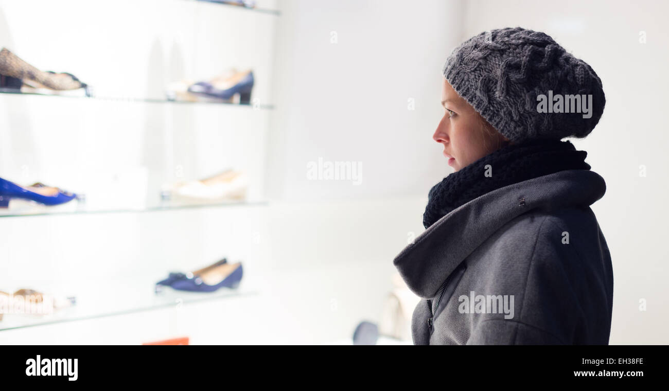 Woman window shopping Stock Photo - Alamy