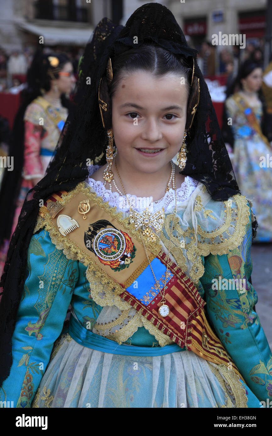 Portrait of a young girl dressed in traditional las Fallas costumes ...