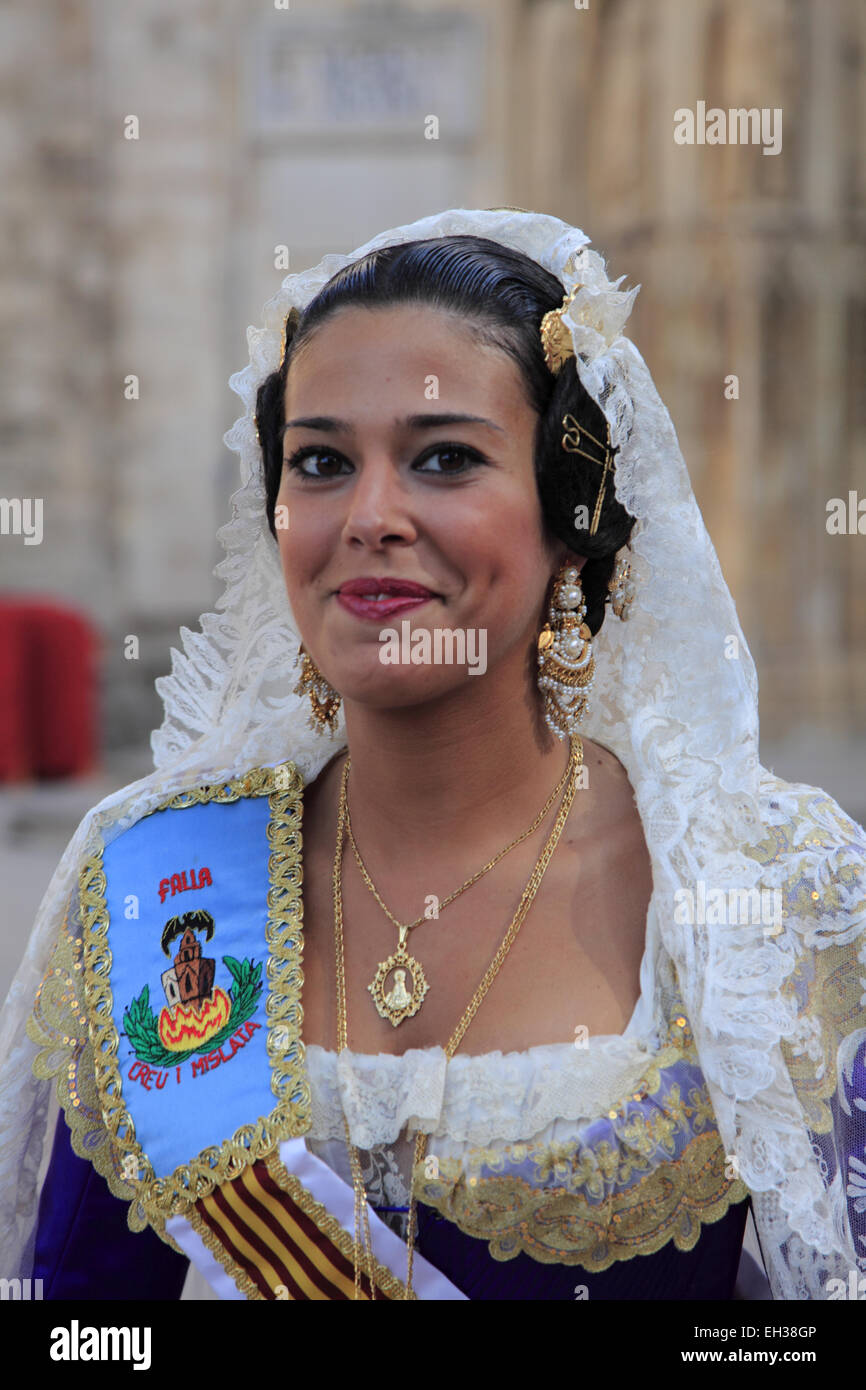 Portrait of a young lady dressed in traditional las Fallas costumes ...