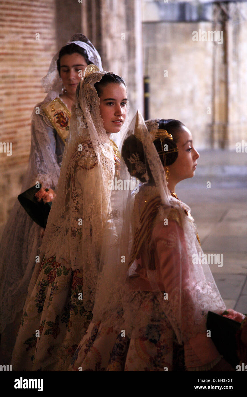 Three girls in traditional las fallas costumes during night parade of ...