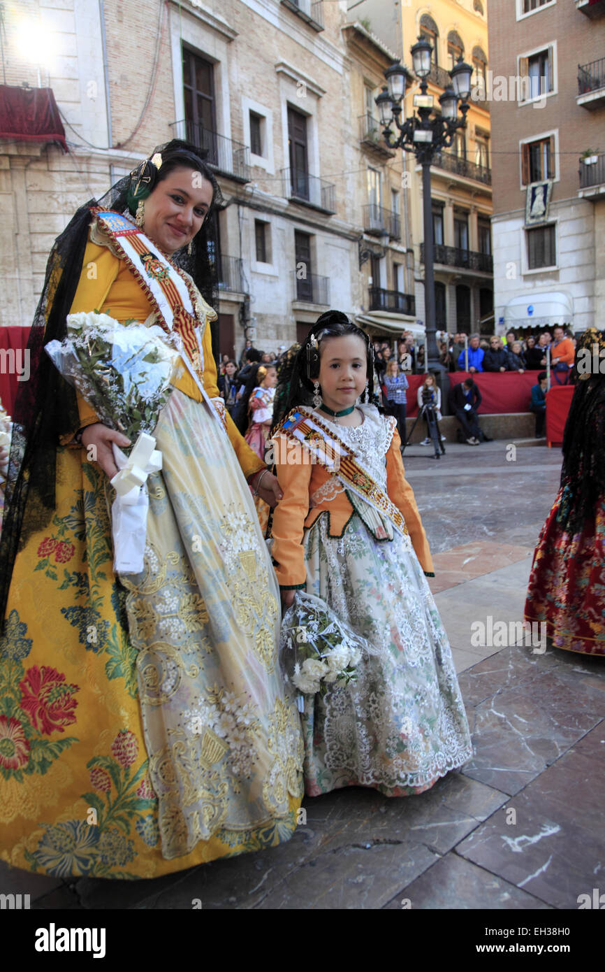 Mother and daughter dressed in traditional las Fallas costumes holding ...
