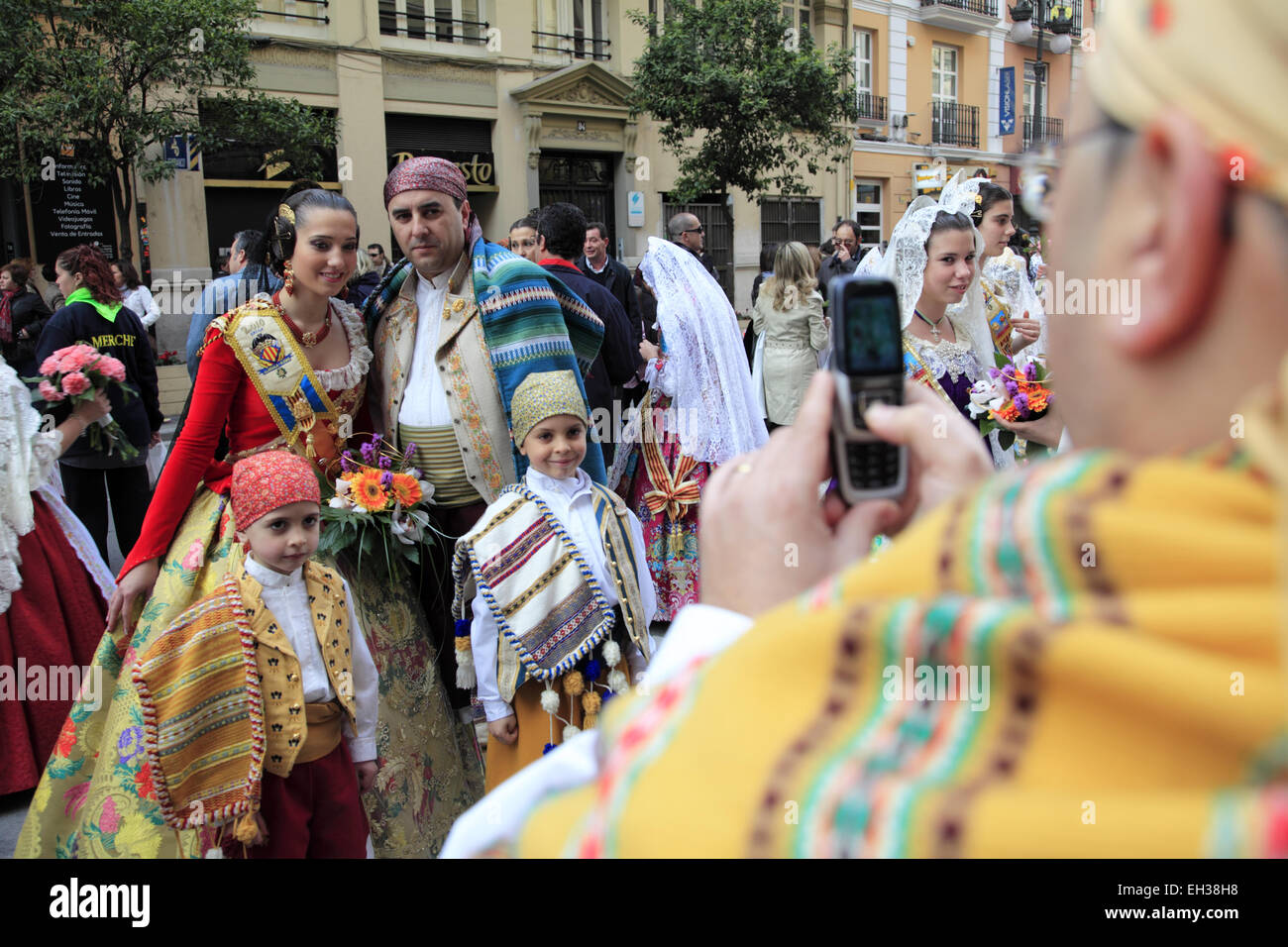 A family in traditional Las Fallas festival costumes with their photo ...