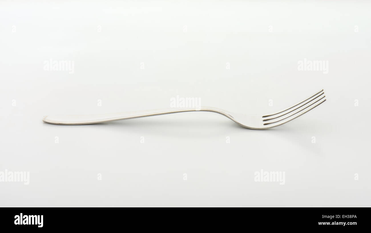 One metal fork on white background Stock Photo - Alamy