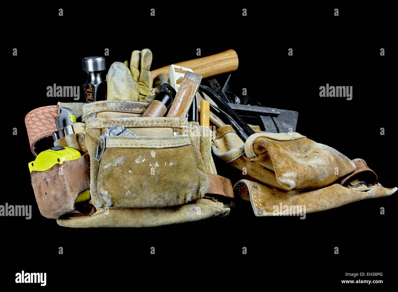 Rugged worn carpenters leather work bags and belt with used ...