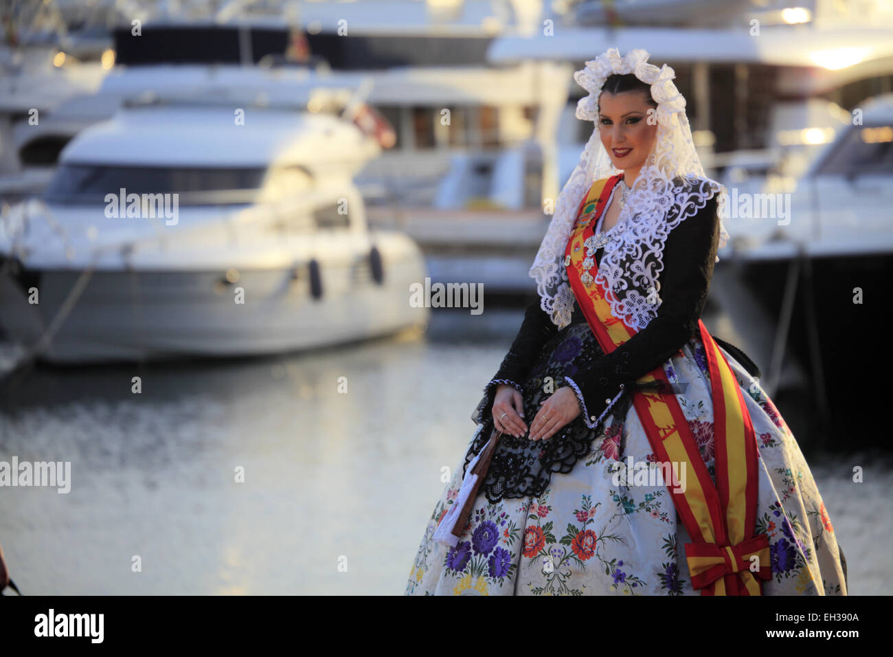 Portrait of a woman in traditional Valencia festival outfits in port of ...