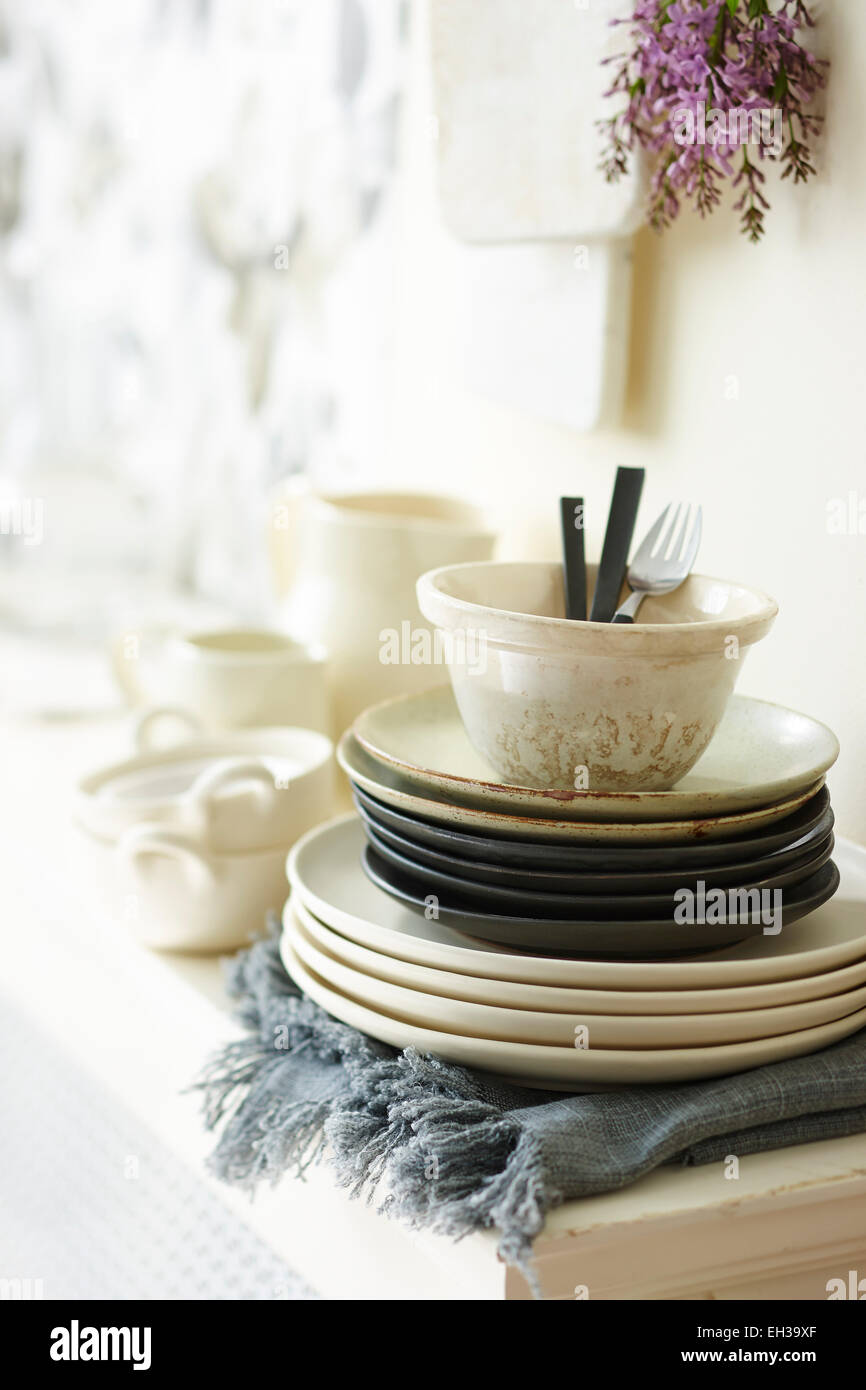 Close-up of Stack of Dishes on Sideboard in Dining Room Stock Photo - Alamy