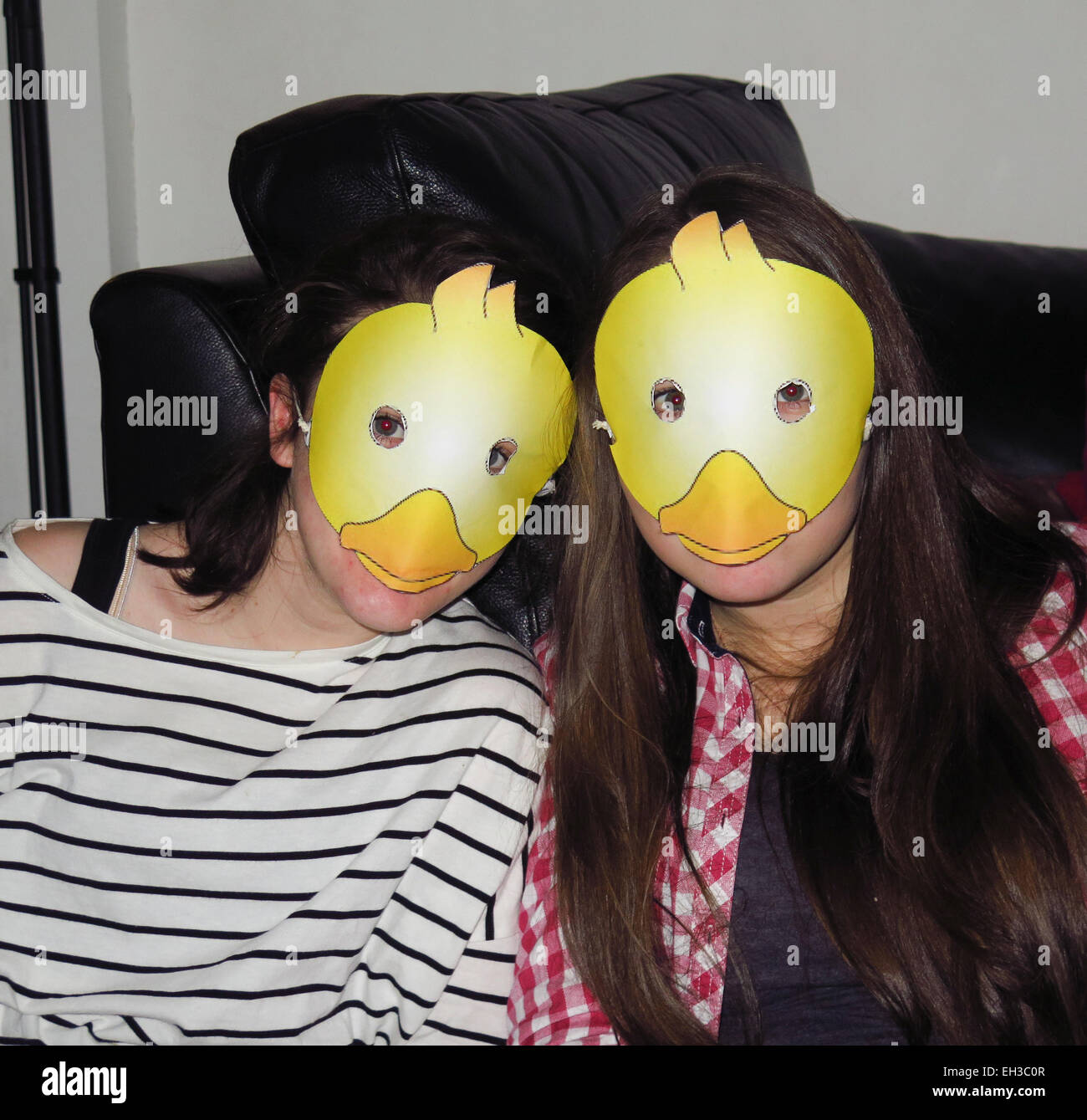 Two children wearing funny duck masks Stock Photo - Alamy