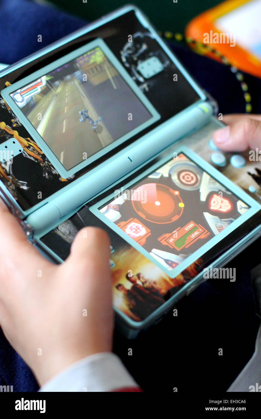 A child playing Nintendo DS showing screen in focus Stock Photo - Alamy