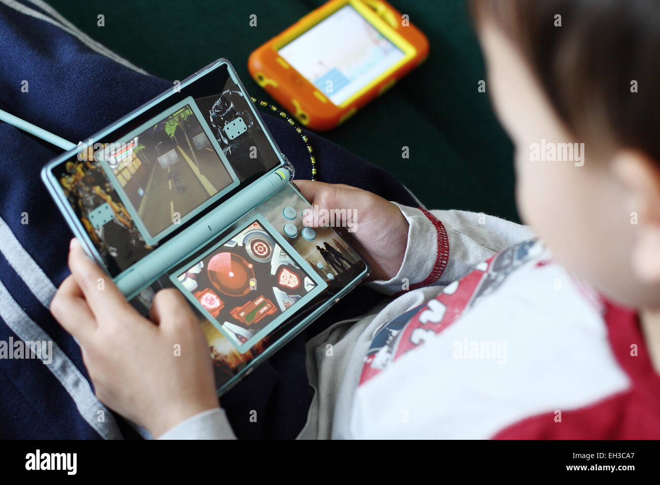 A child playing Nintendo DS Stock Photo - Alamy