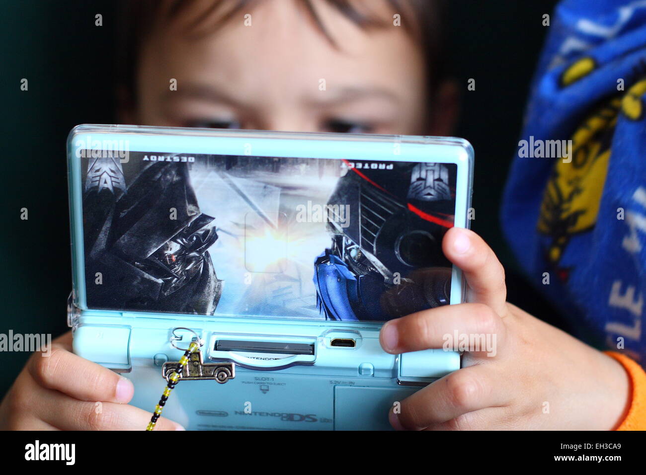 A child playing Nintendo DS Stock Photo - Alamy
