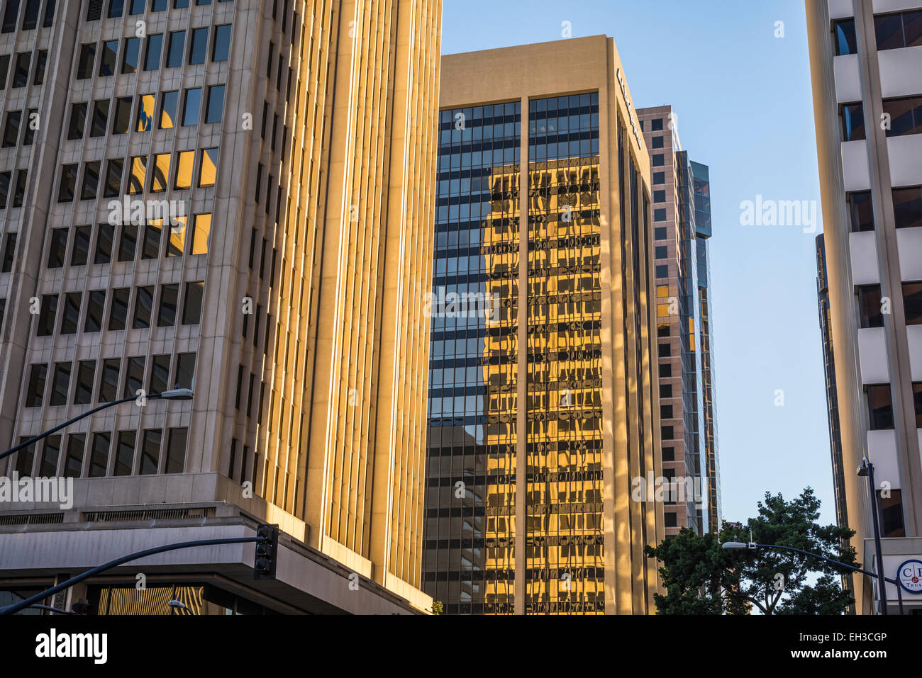 The rising Sun illuminating buildings in Downtown San Diego. San Diego ...