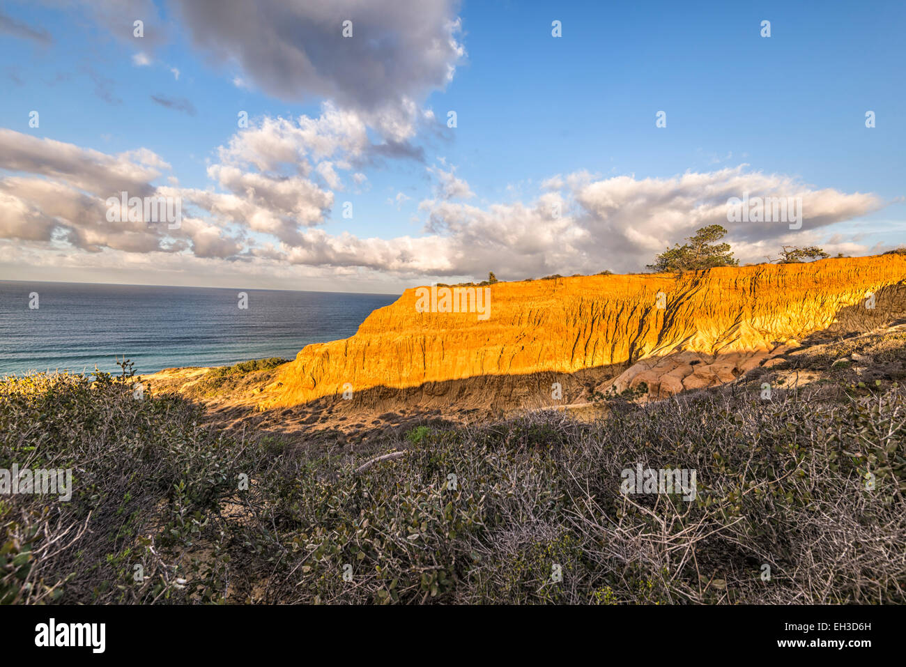 Sun illuminating the sandstone cliffs at the Razor Point Overlook ...