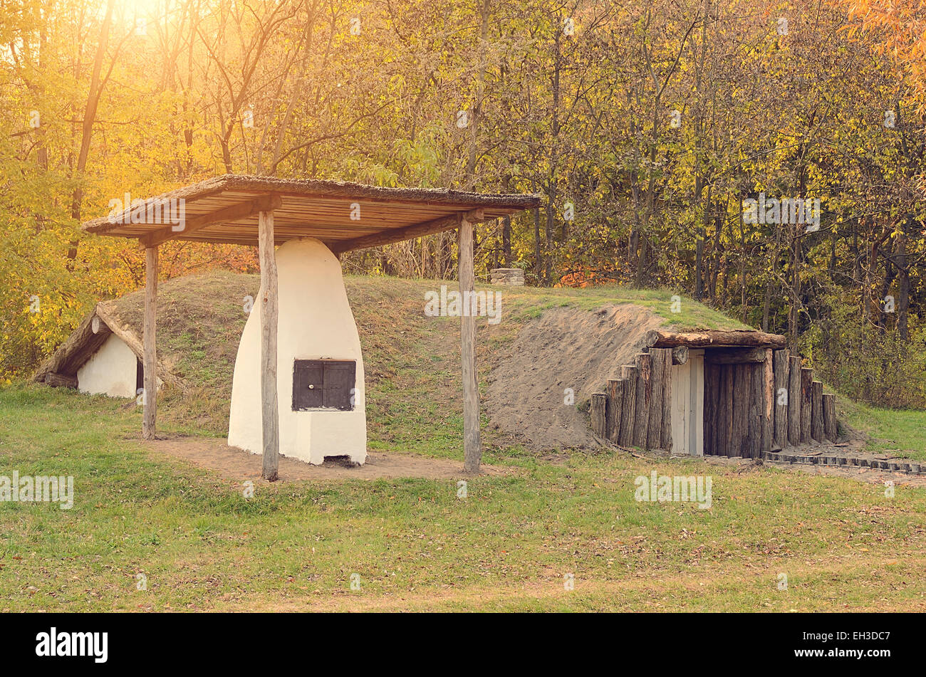 Photo of a ground house near the forest Stock Photo - Alamy
