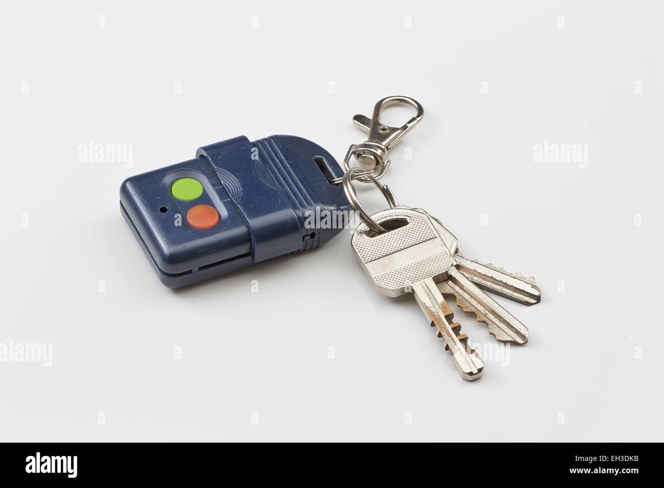 Remote control with keys in clean background Stock Photo - Alamy