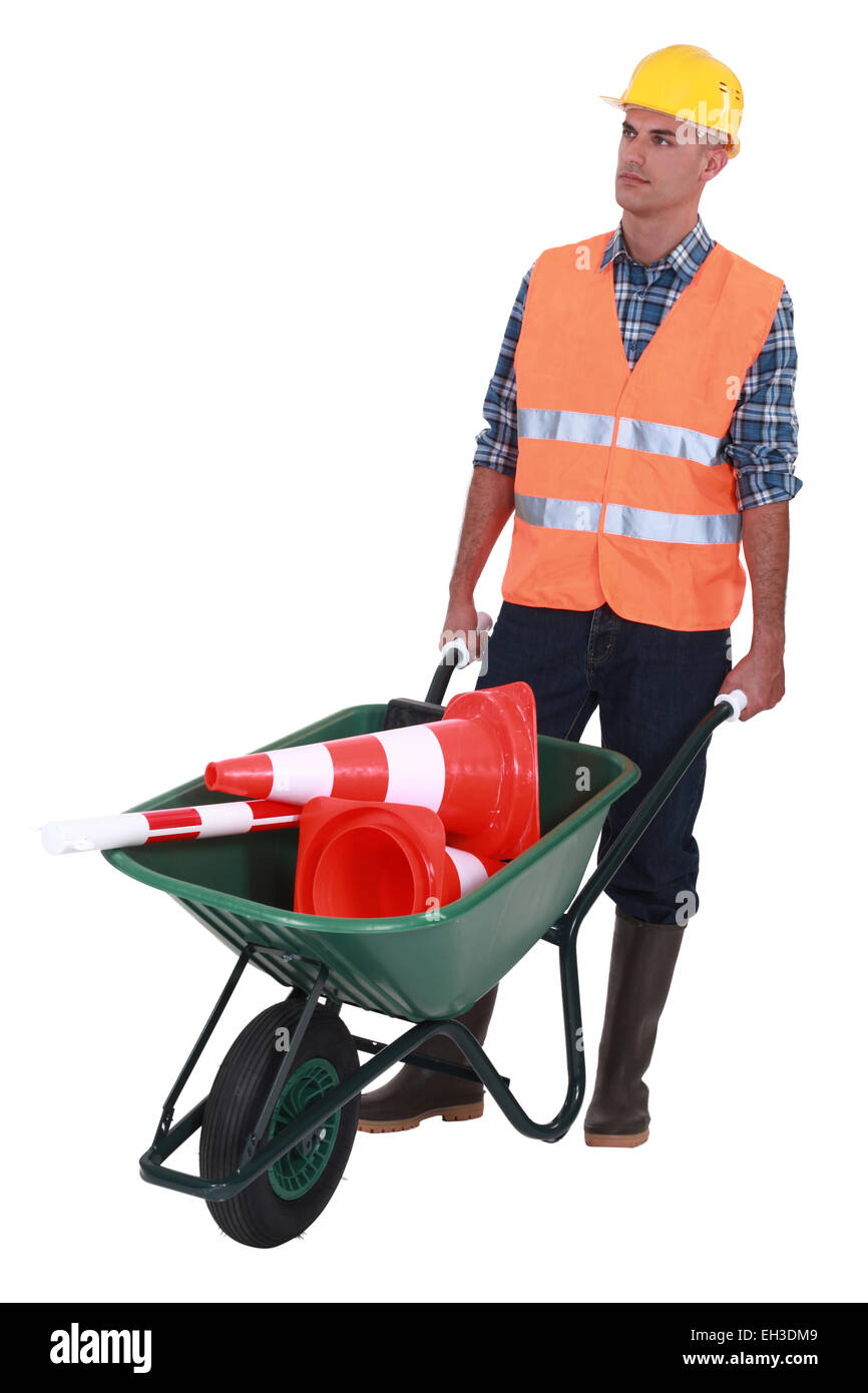 Man hauling barrow hi-res stock photography and images - Alamy