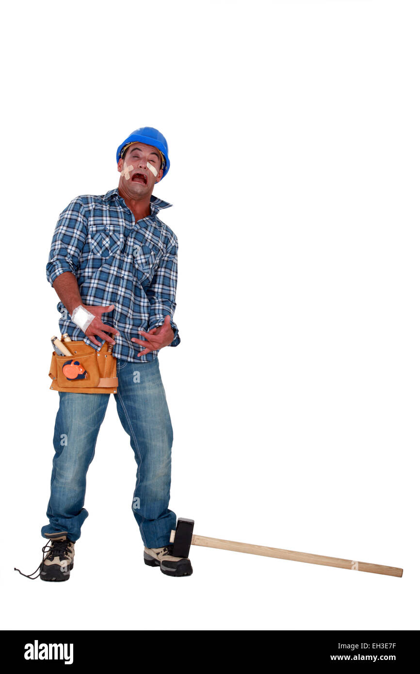 Accident prone worker Stock Photo - Alamy