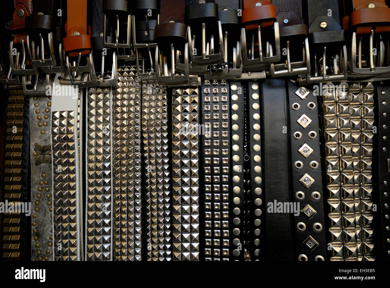 Belts for sale on a leather stall in a city centre market, Florence ...