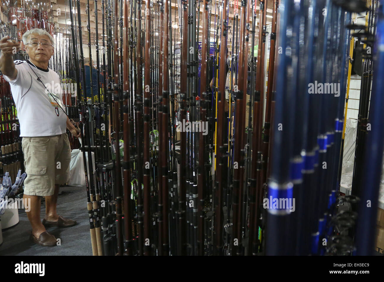 Sao Paulo, Sao Paulo. 5th Mar, 2015. A visitor tries a fishing rod ...