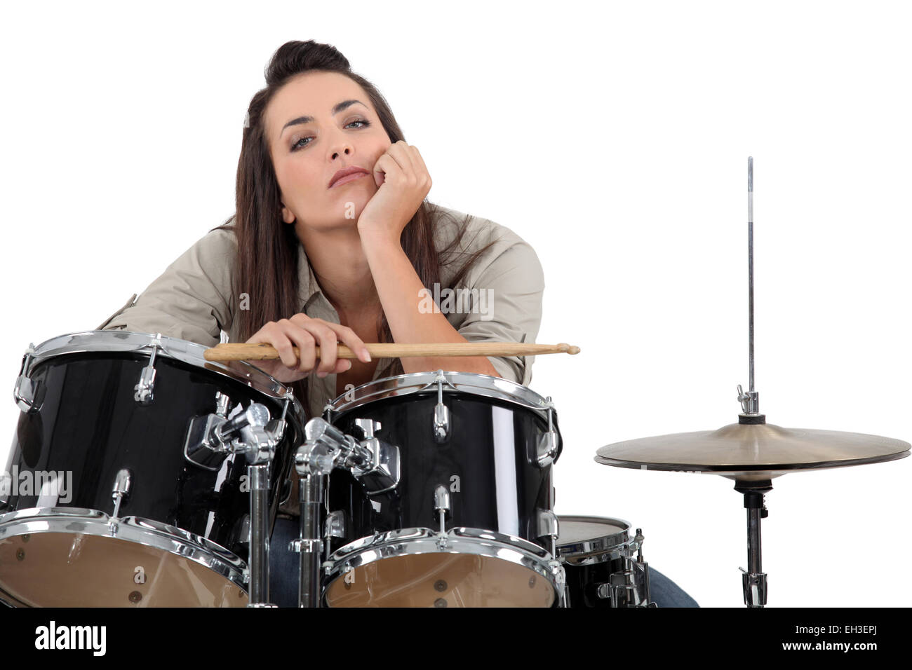Woman sat with drum kit Stock Photo - Alamy
